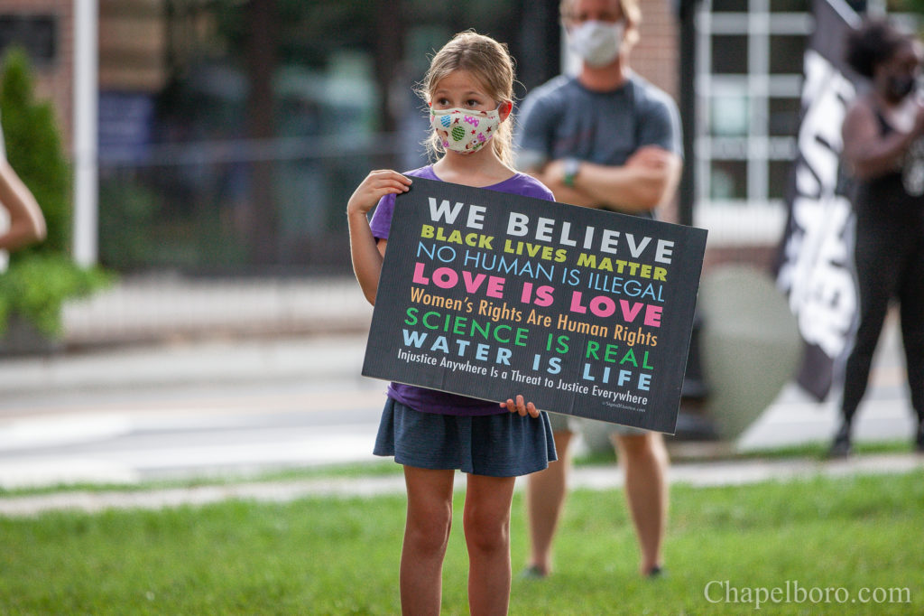 Photo Gallery: Residents Gather in Protest After White Supremacists ...