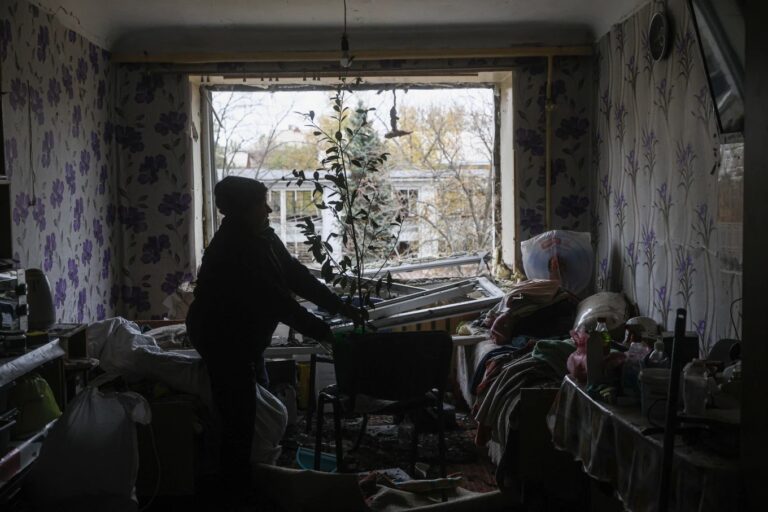 Panasenko clears rubble inside her room AP Photo Kateryna Klochko ...